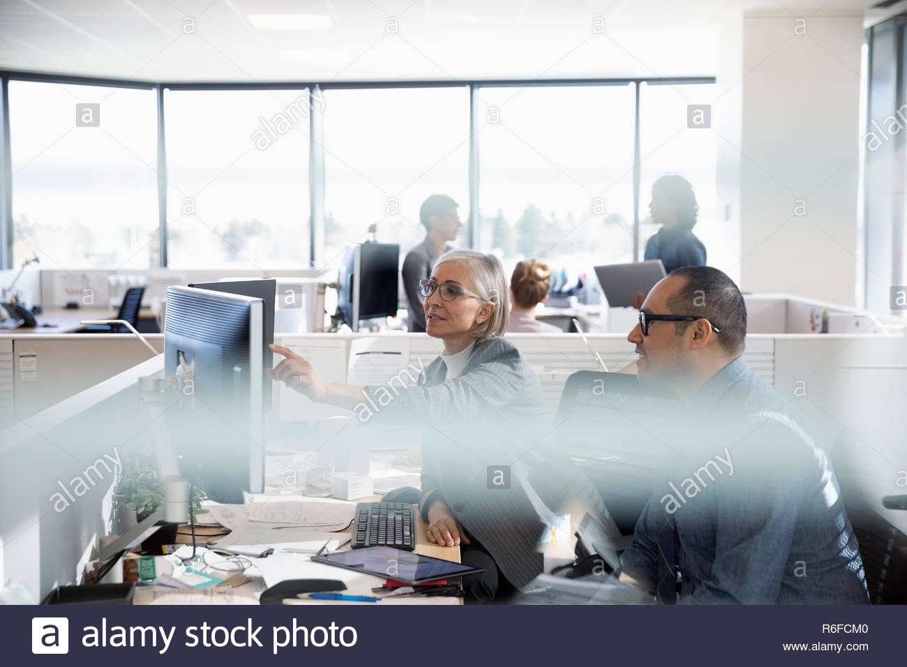 Business people working at computer in office cubicle Stock Photo - Alamy