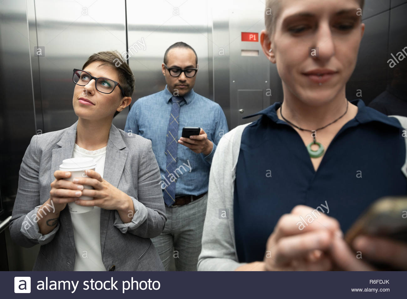 Elevator Man Looking Up Stock Photos & Elevator Man Looking Up Stock ...