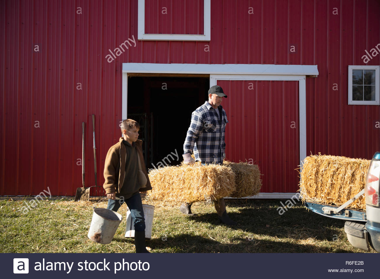 Boy carrying buckets hi-res stock photography and images - Alamy
