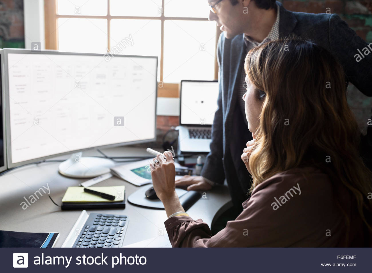 Business people planning at computer in office Stock Photo - Alamy