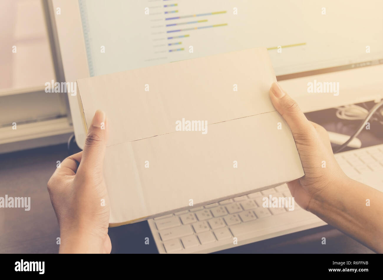 Close-up of parcel box and hand holding a package, Delivery concept and ...