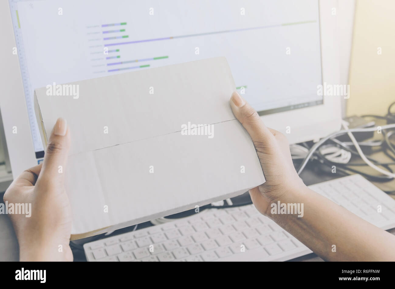 Close-up of parcel box and hand holding a package, Delivery concept and ...