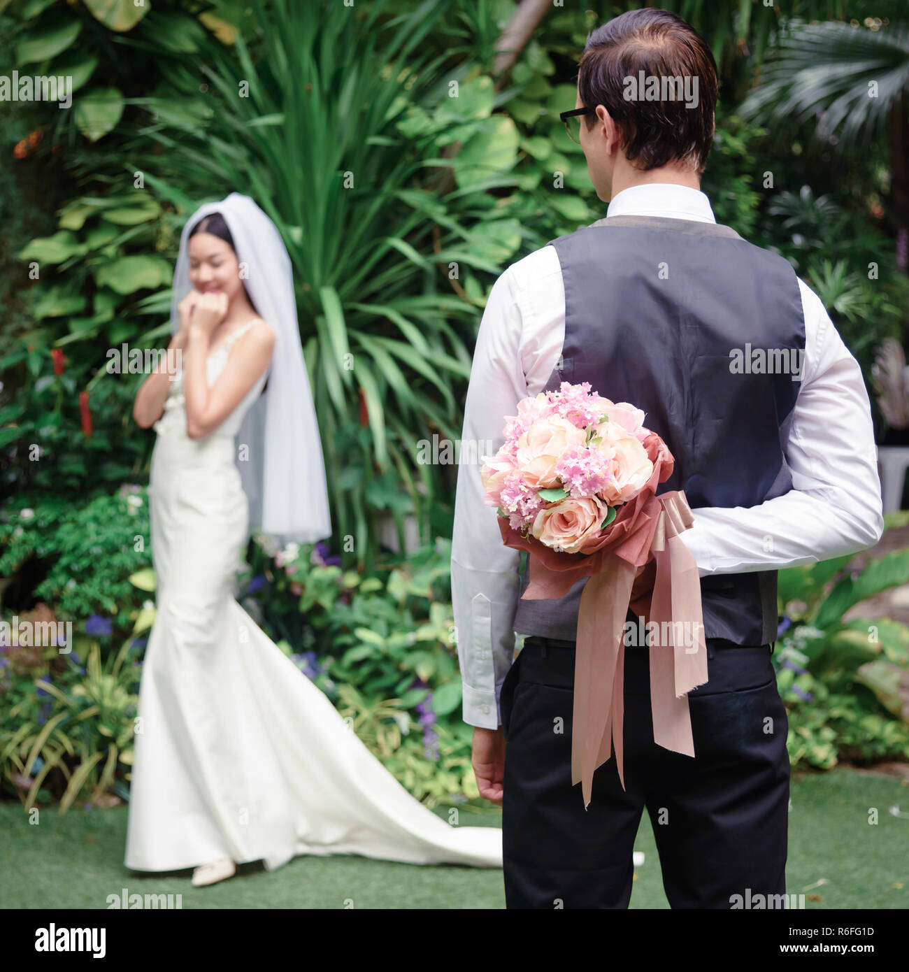 Hide flowers behind back hi-res stock photography and images - Alamy