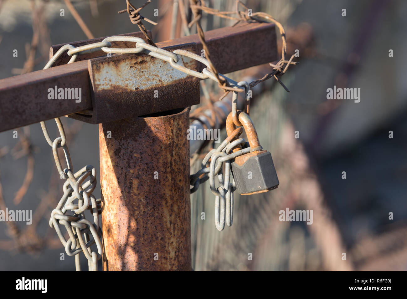 Blurred background with rusty metal wire and lock Stock Photo - Alamy