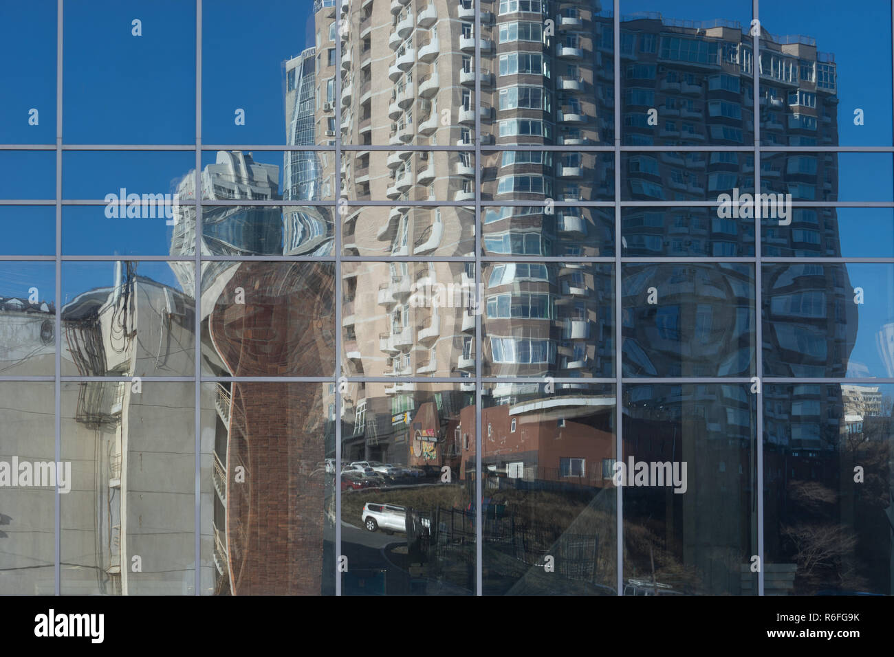 Background with mirror reflection of a high-rise building with strong ...