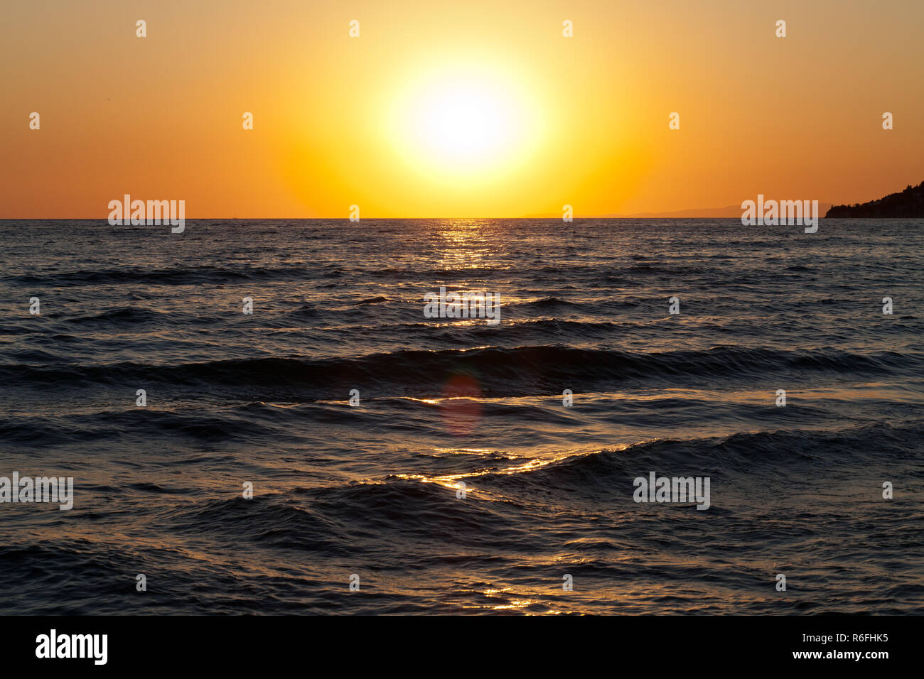 Sunset over the sea Stock Photo - Alamy