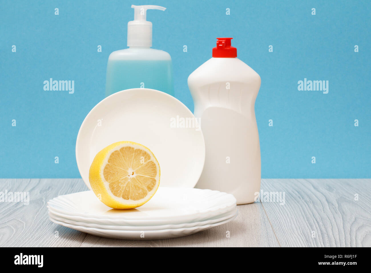 Plastic bottles of dishwashing liquid, glass and tile cleaner, clean ...