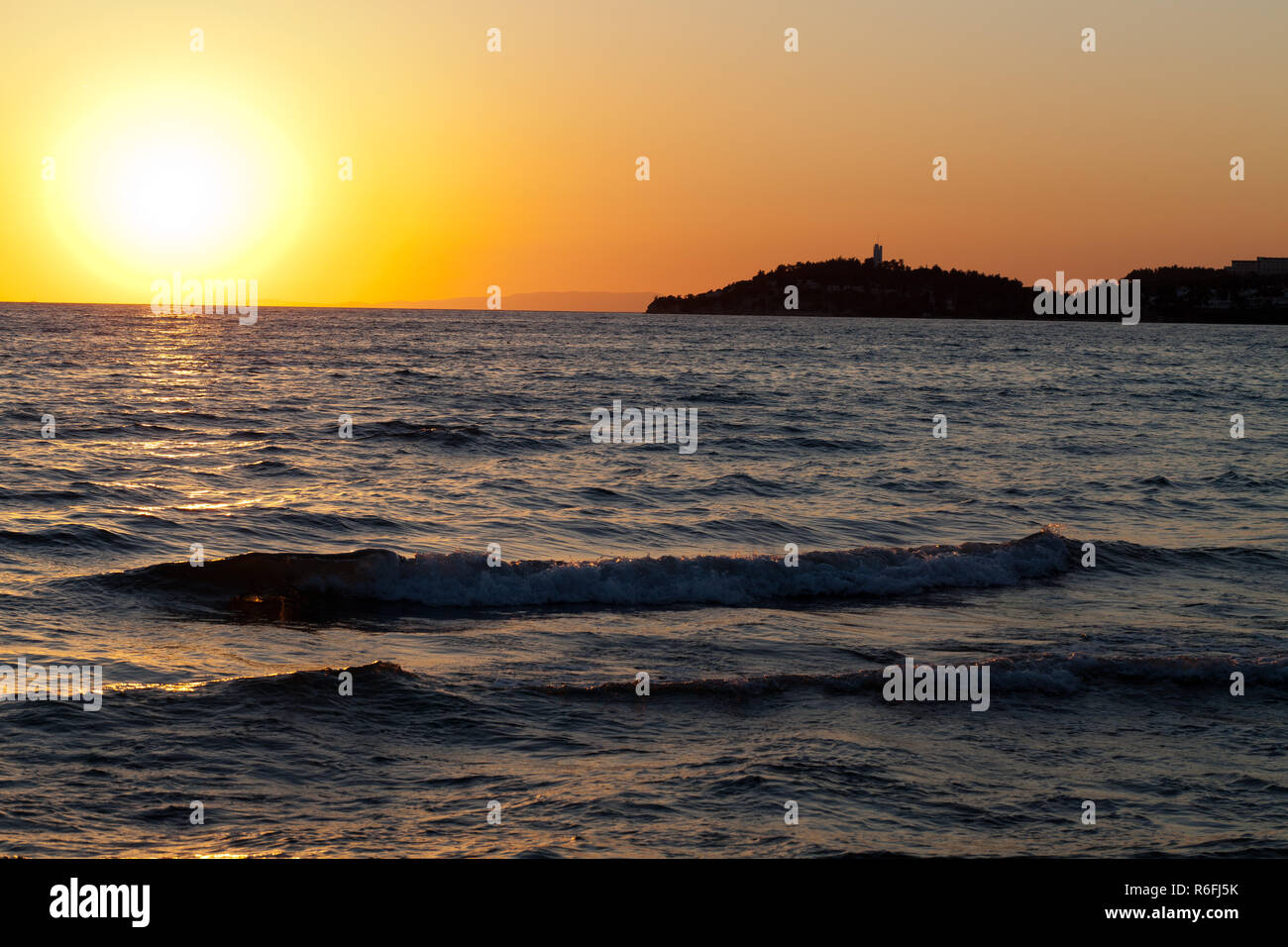 Sunset over the sea Stock Photo - Alamy