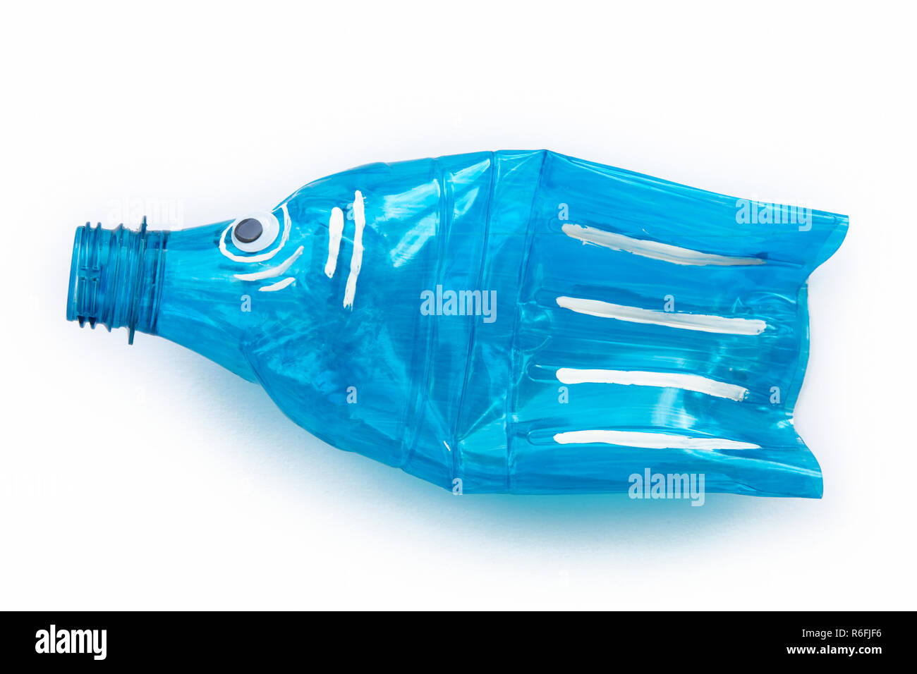 Plastic bottle recycled in a fish figure. Reuse garbage. Isolated Stock ...
