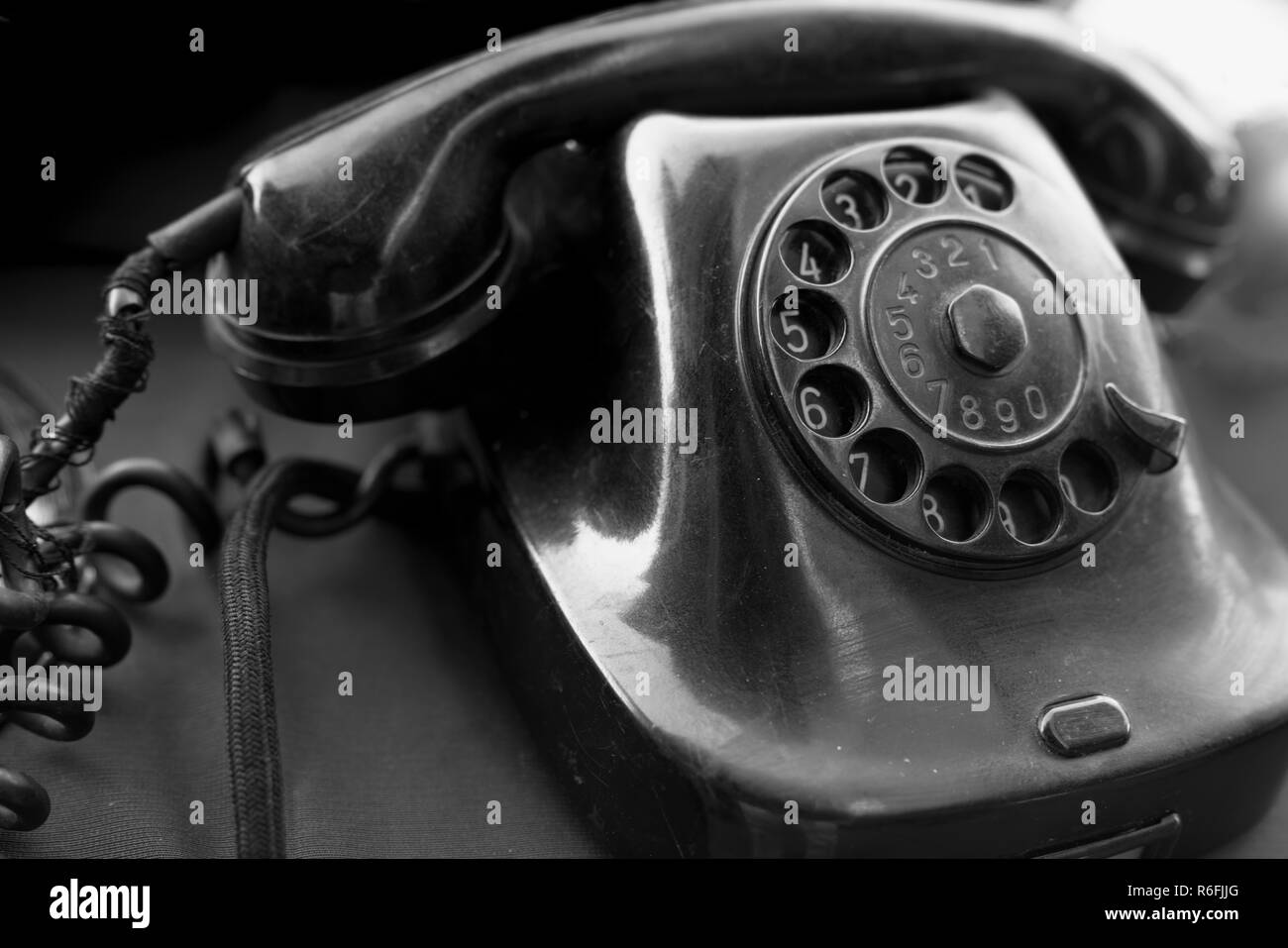 Old vintage antique black phone with rotary disc Stock Photo - Alamy