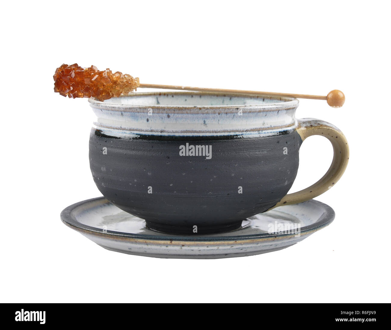 Cup with sugar stick on white background Stock Photo - Alamy