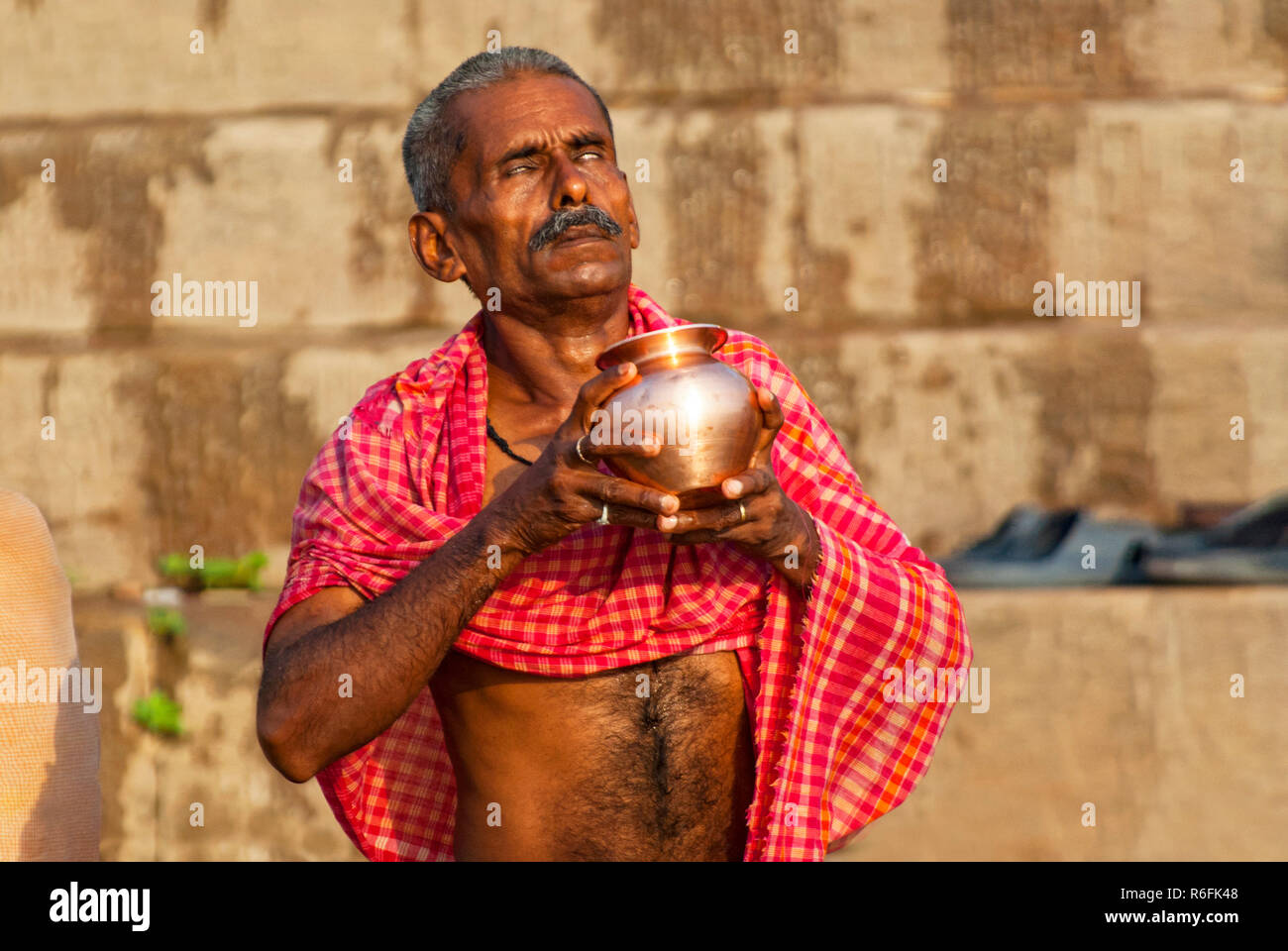 Brahmin Man Meditating At The Holy River Ganges In The Morning ...