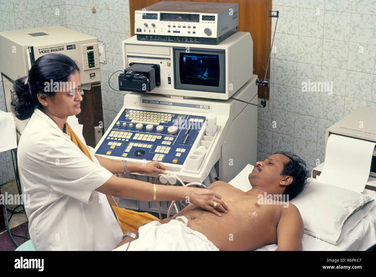 Doctors checking Patient Stock Photo - Alamy
