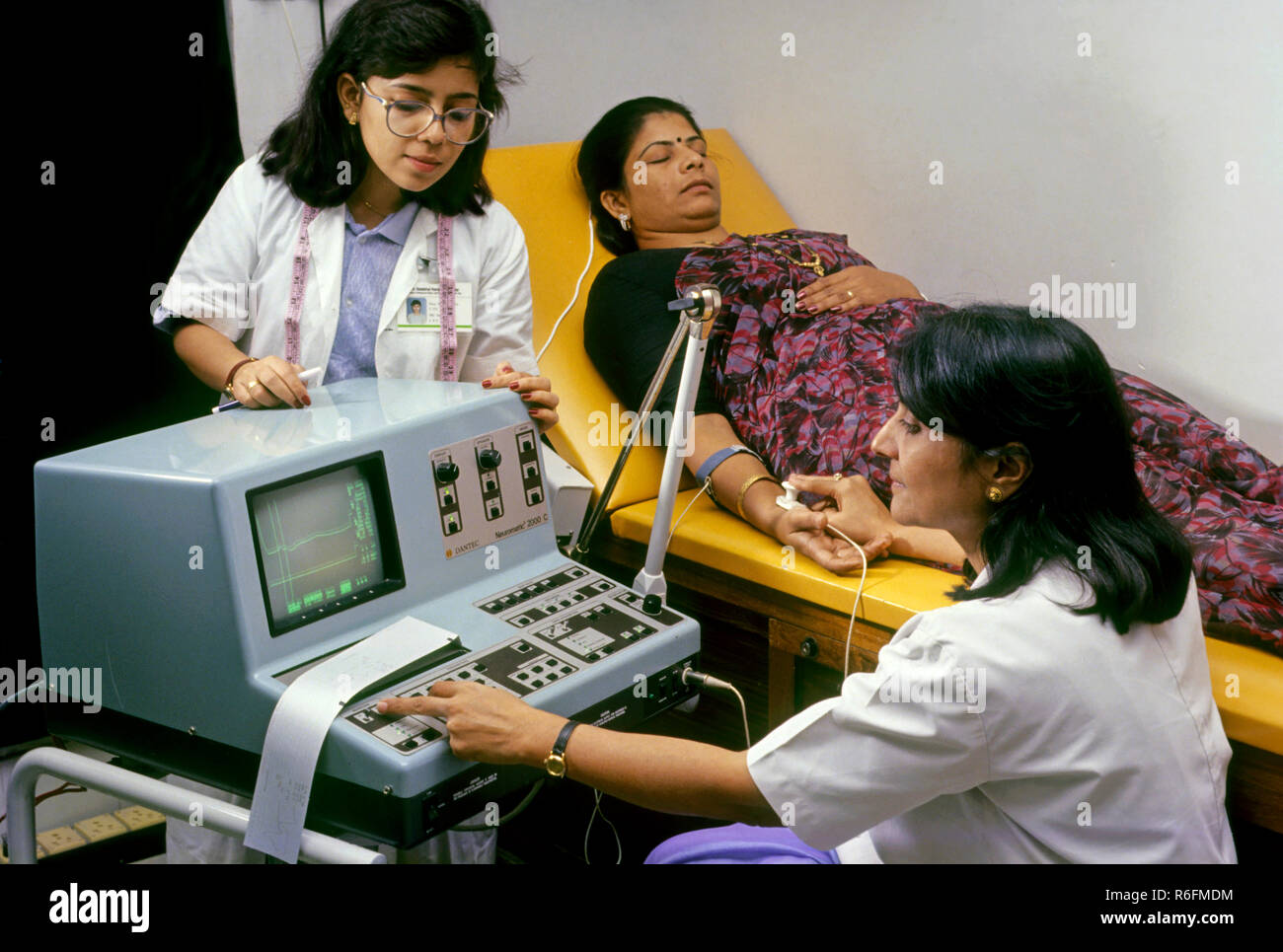 Doctors checking Pulse of Patient Stock Photo - Alamy