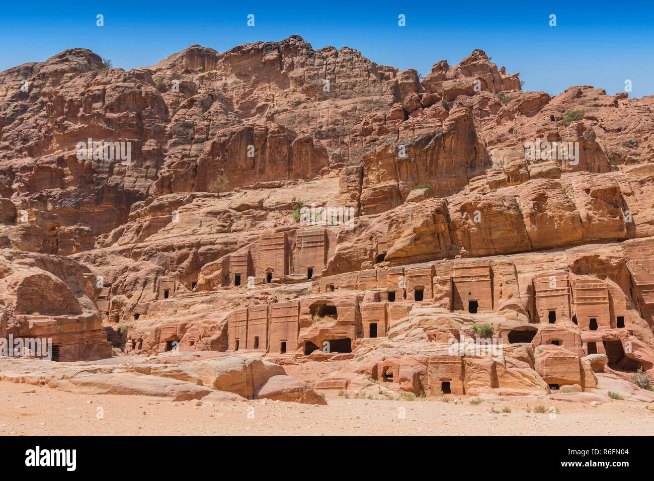 View Of Large Cliff Side Tomb Carved From The Beautiful Richly-Colored ...