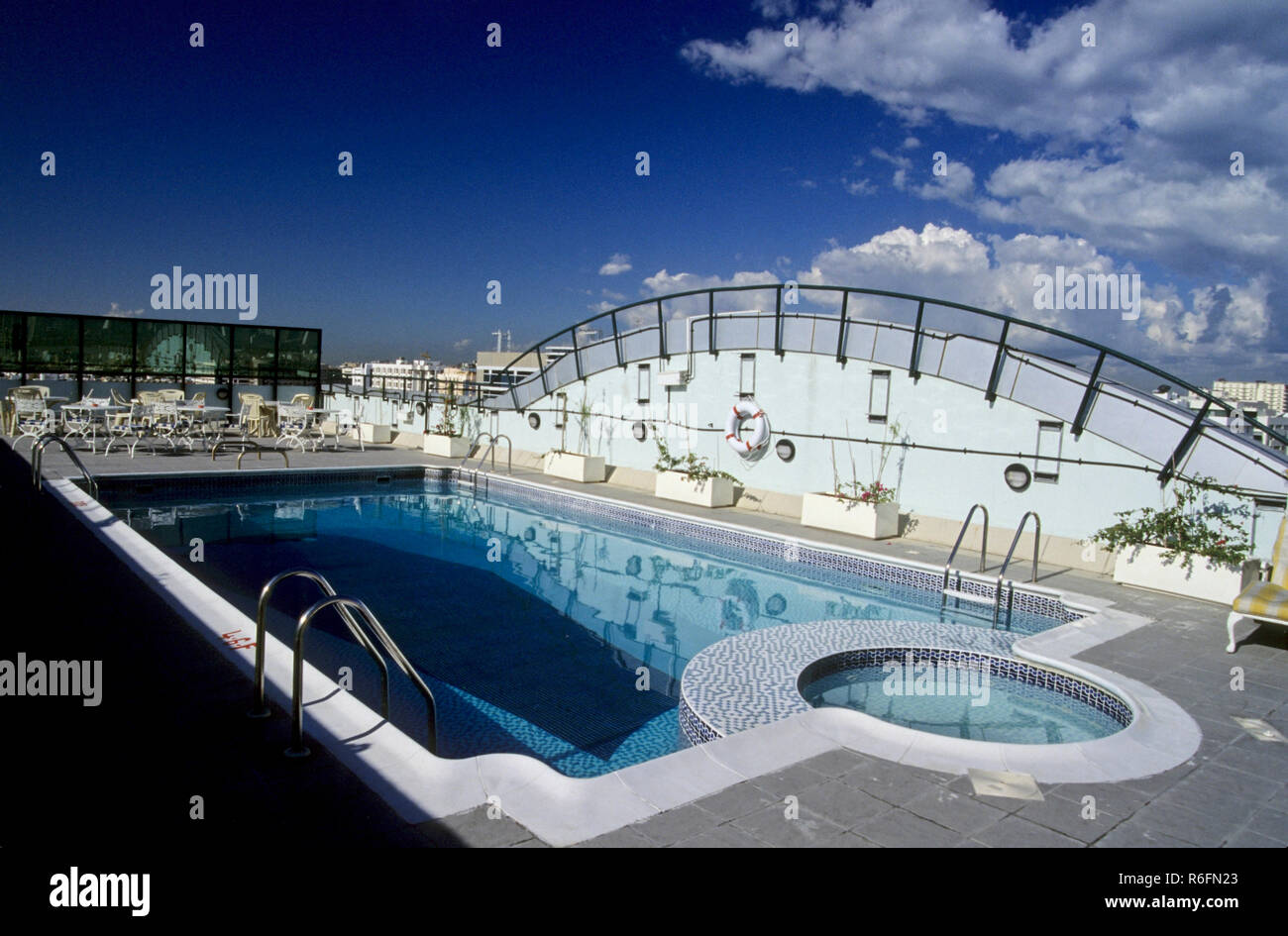 Swimming pool blue clean water and stainless steel railings, Landmark ...