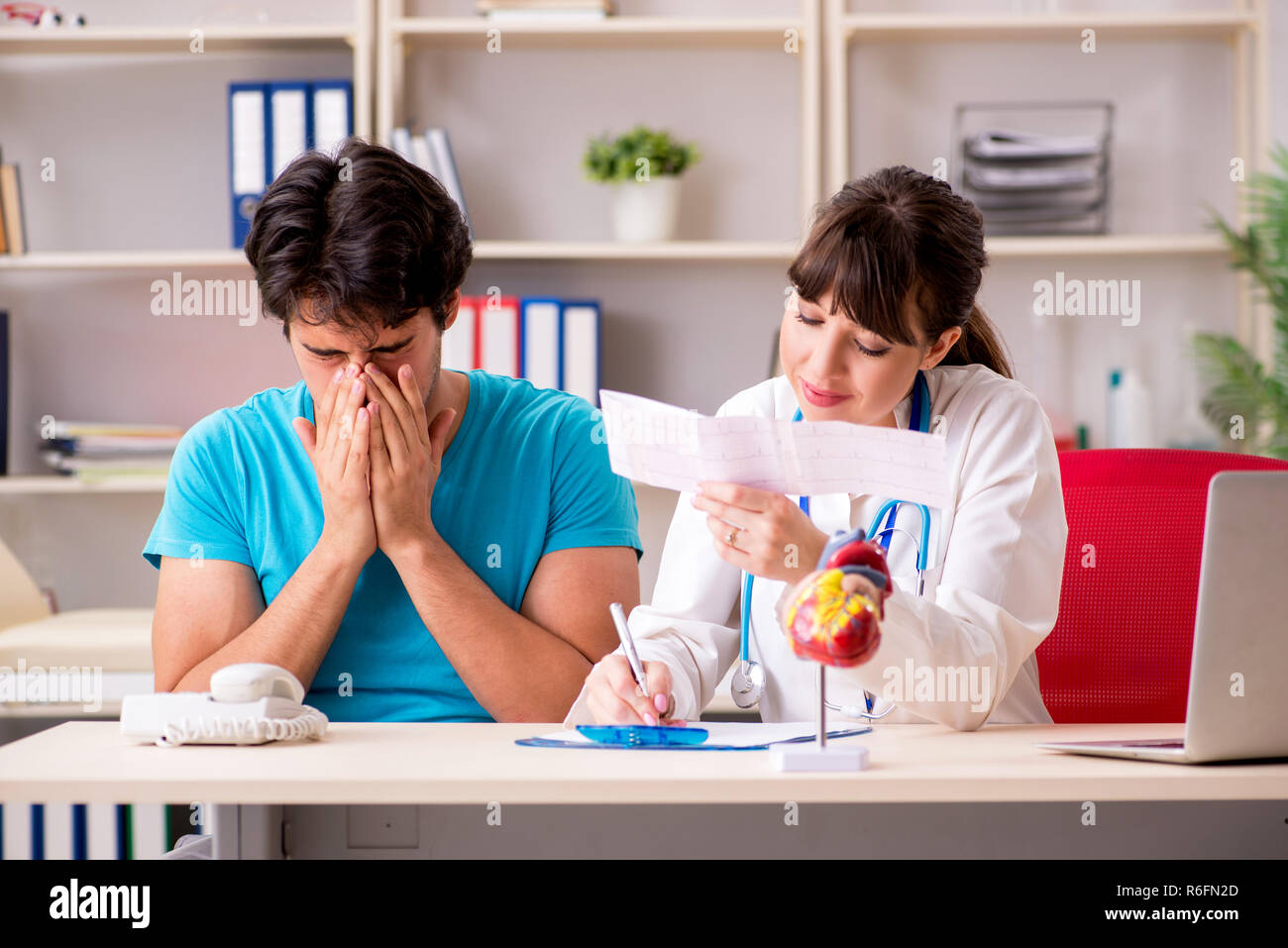 Young patient visiting doctor cardiologist Stock Photo - Alamy
