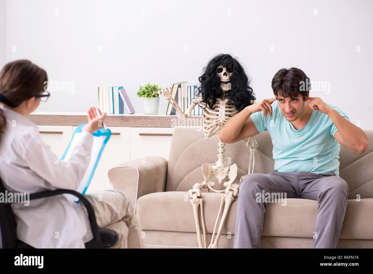Young patient visiting psychologist for therapy Stock Photo - Alamy