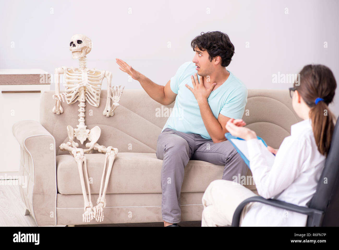Young patient visiting psychologist for therapy Stock Photo - Alamy