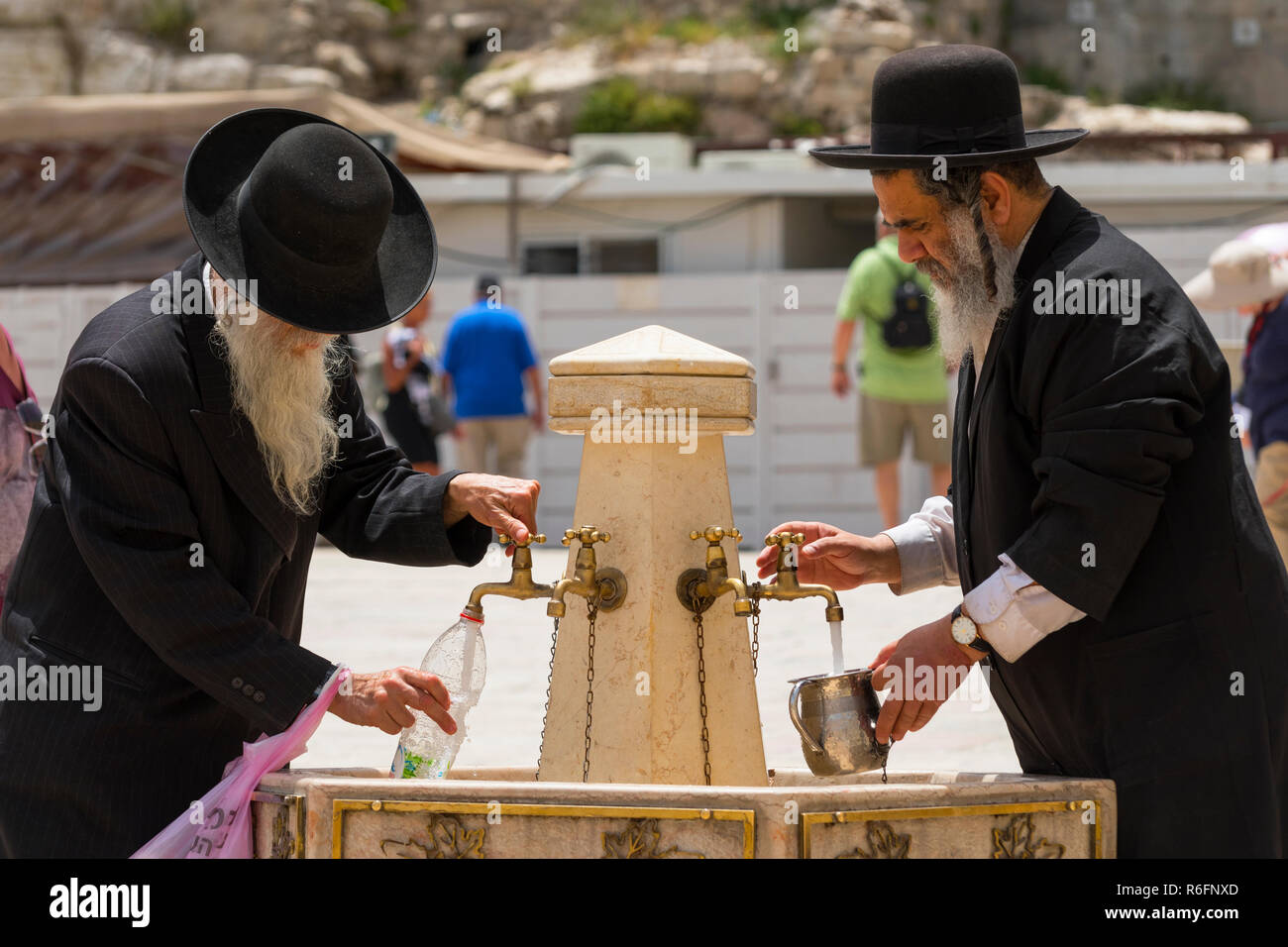 Jewish Orthodox Men At Wailing Wall Filling Mug With Drinking Water ...