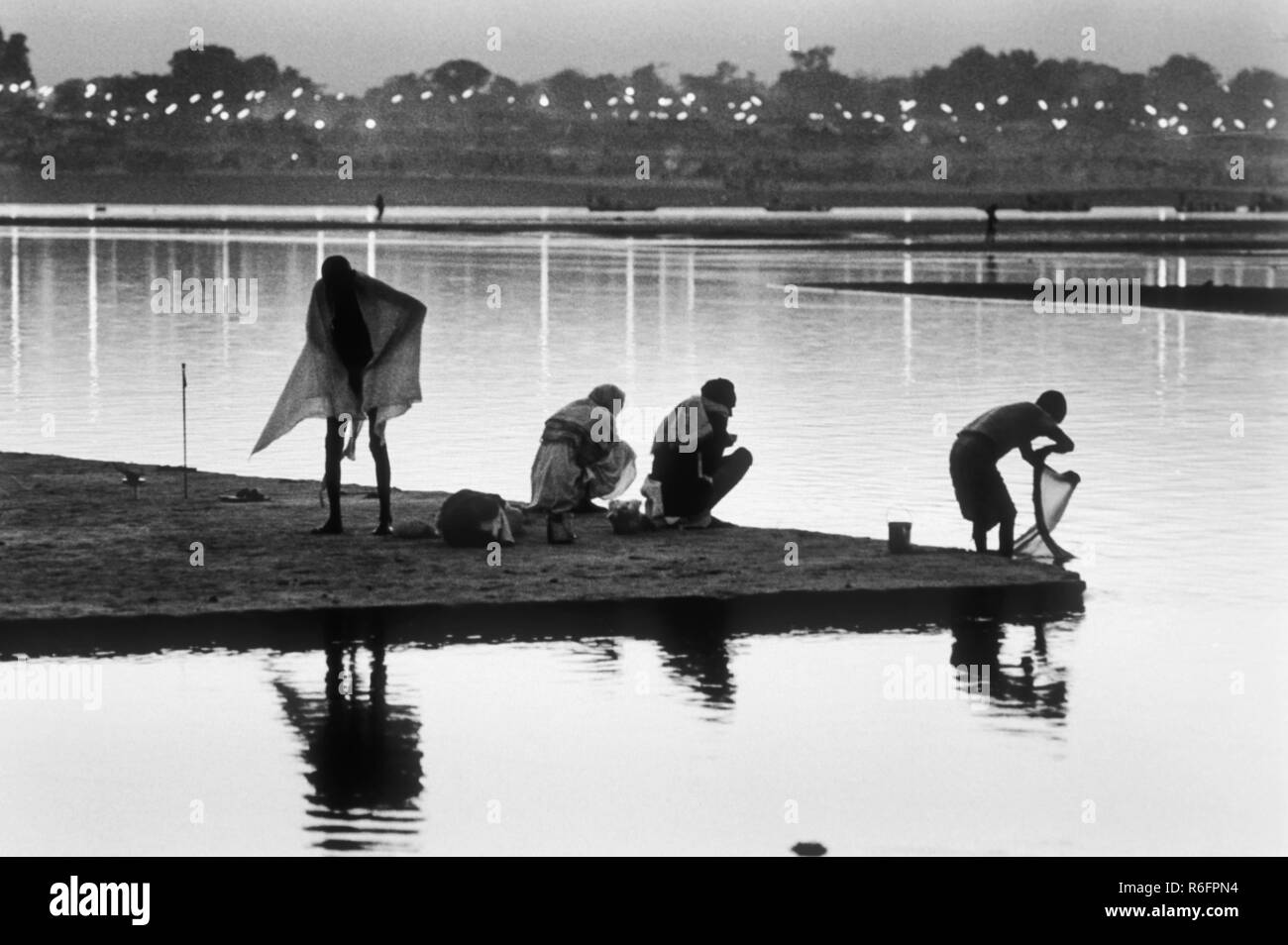 Indian men bathing Black and White Stock Photos & Images - Alamy