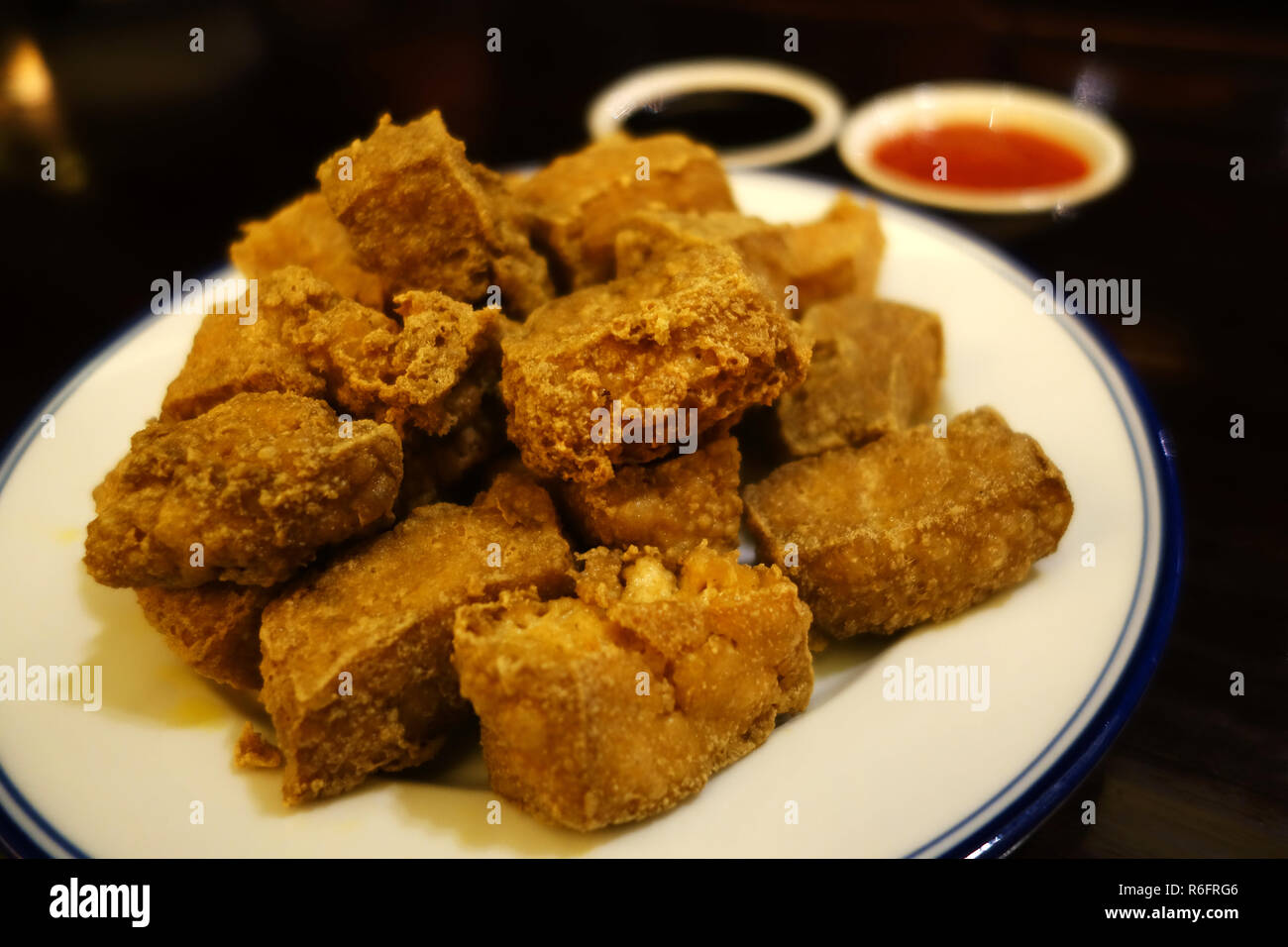 Stinky fried tofu at a Shanghai street Stock Photo - Alamy