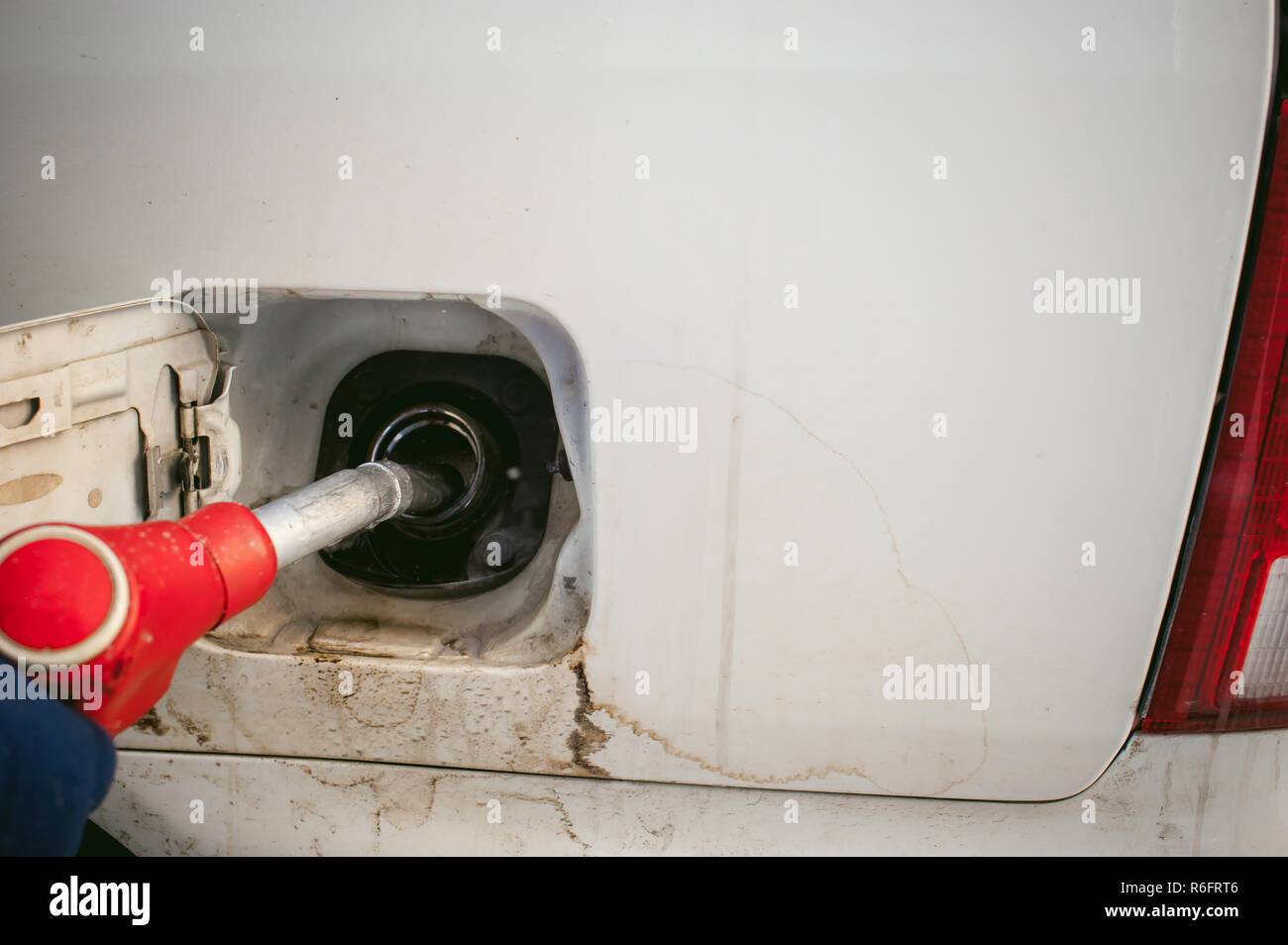 refueling nozzle is inserted in the tank car at a gas station Stock ...