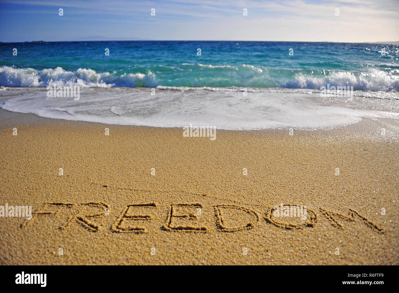 Freedom sign on the sand beach, summer scene Stock Photo - Alamy