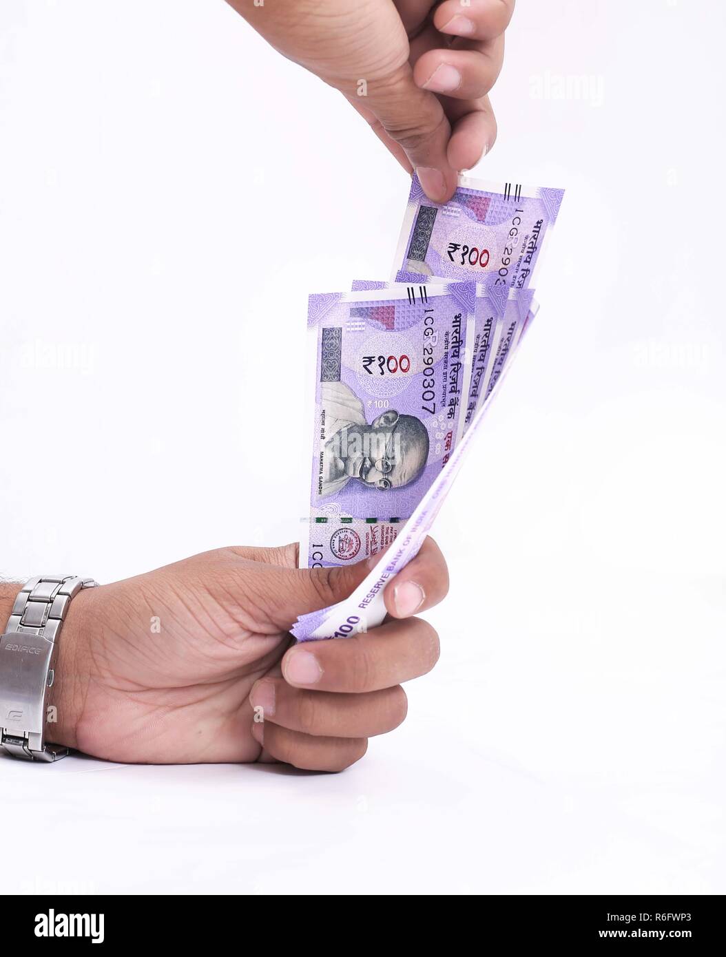 Picture of hand is holding Indian 100 rupee currency. Isolated on the ...