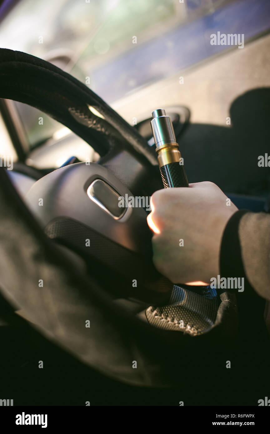 Young male smoking in car hi-res stock photography and images - Alamy