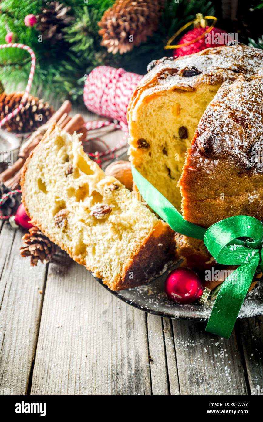 Traditional Christmas panettone with dried fruits and nuts, on old ...
