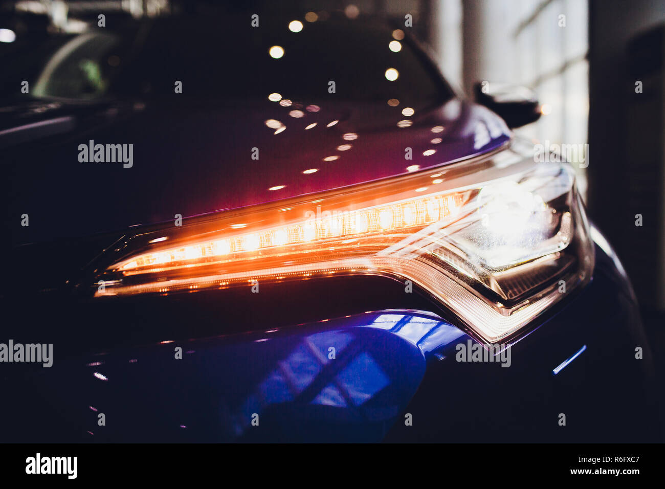 Close up shot headlight in luxury blue car background. Modern and ...