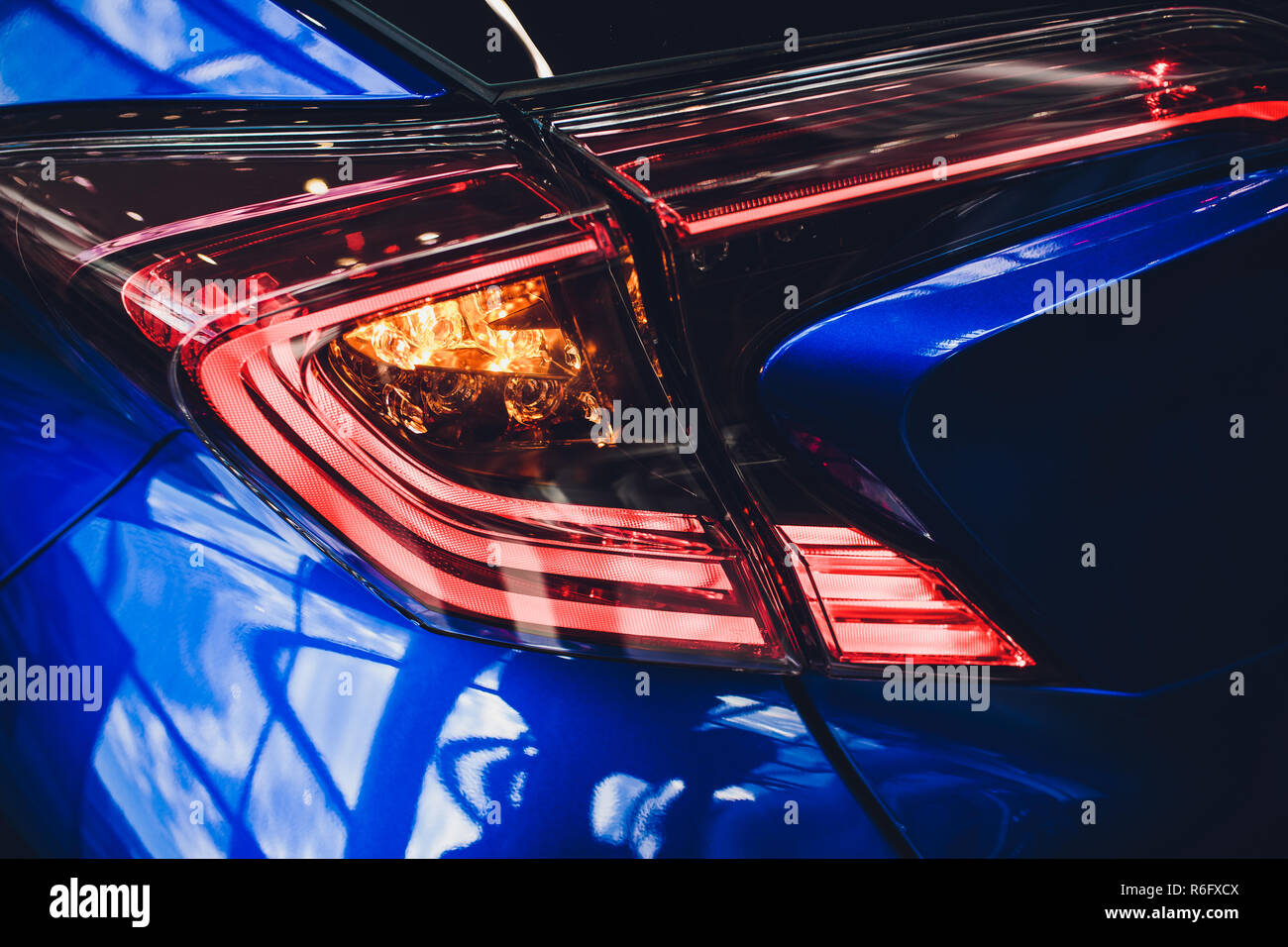 Detail on rear light blue car Stock Photo - Alamy