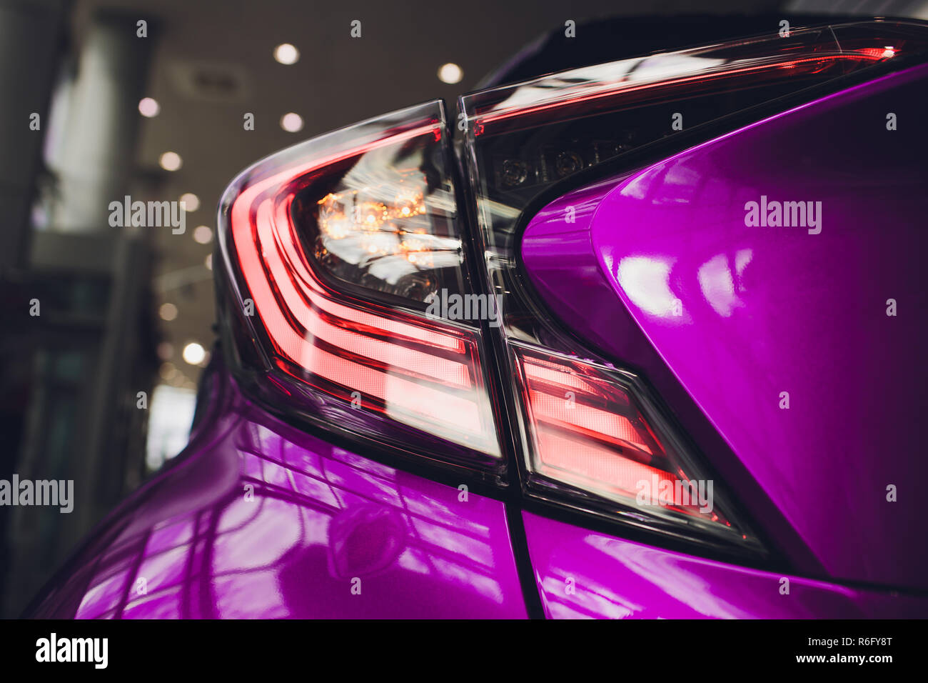 Detail on rear light blue car pink Stock Photo - Alamy
