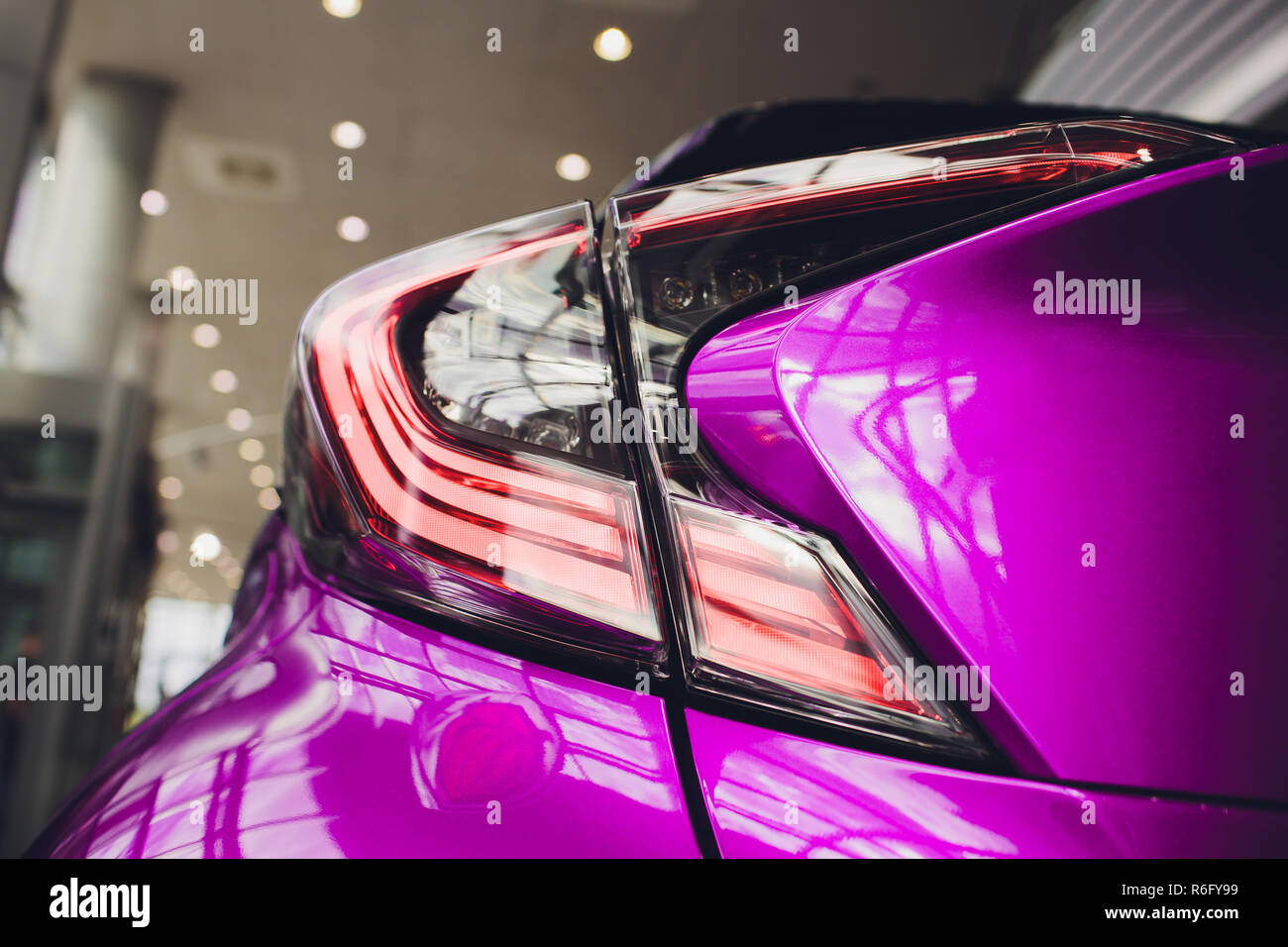 Detail on rear light blue car pink Stock Photo - Alamy