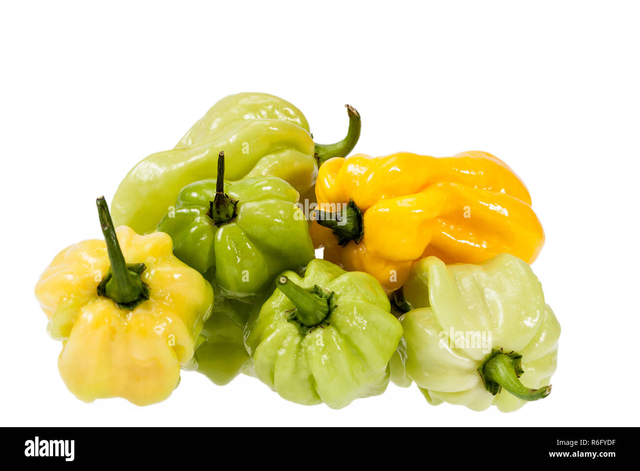 Vegetables of small yellow and green chili pepper habanero on white ...