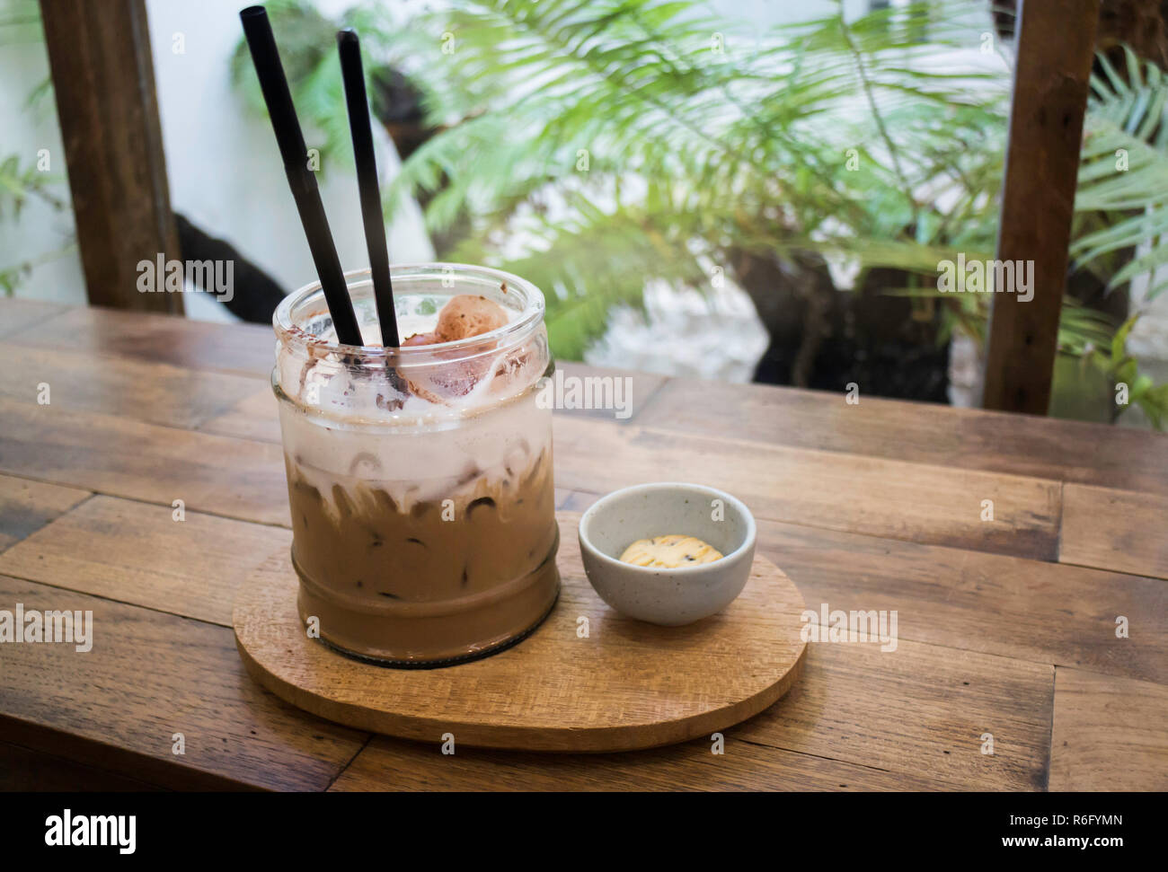 Delicious iced coffee with cookie Stock Photo - Alamy