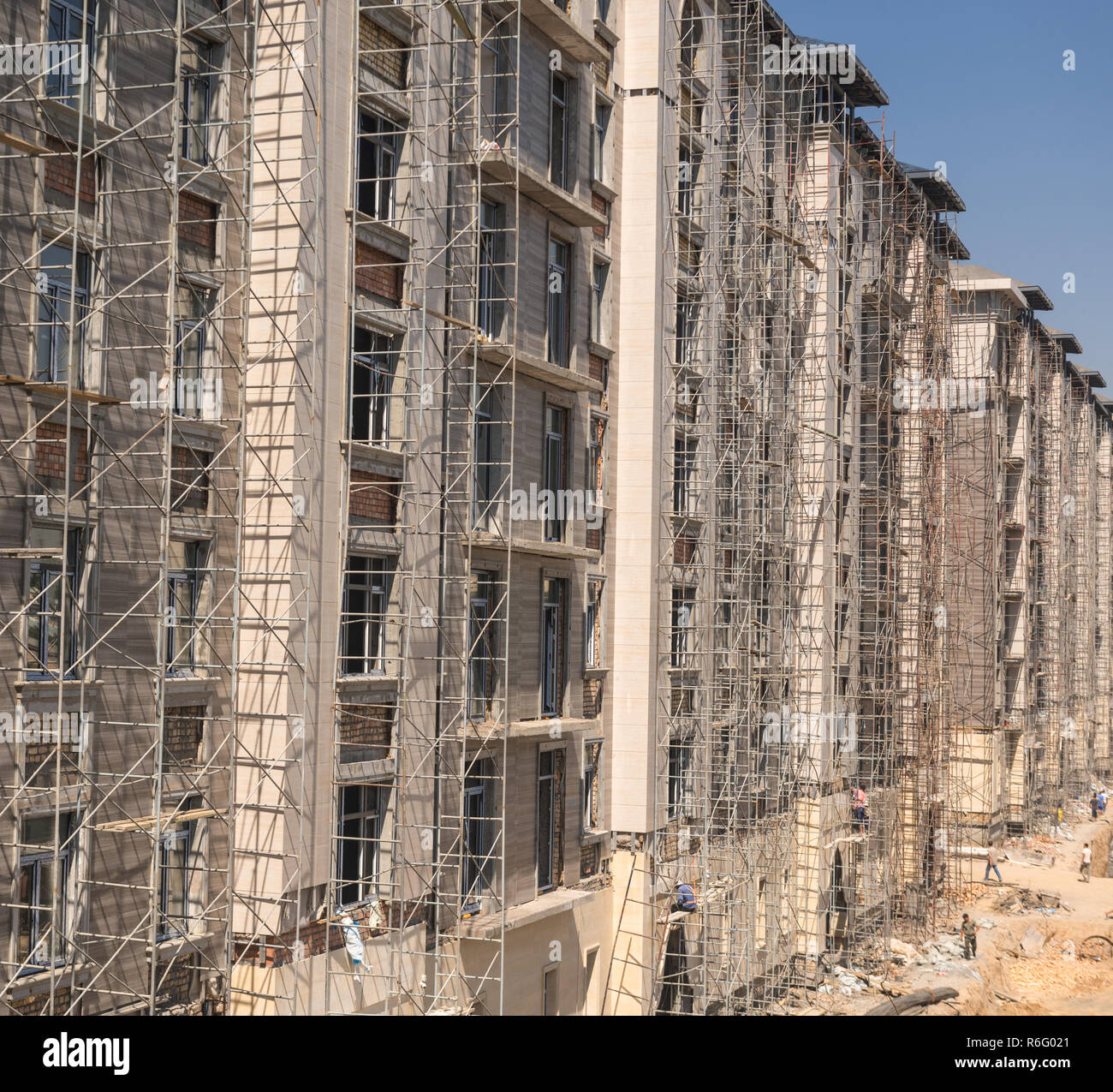 marble finishing works on the facade of a high building Stock Photo - Alamy