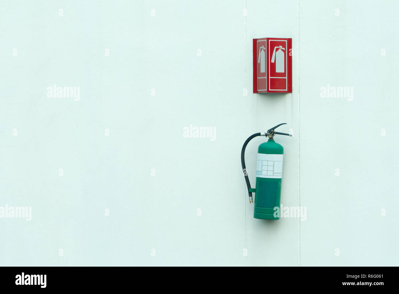 Fire extinguisher hanging on wall hi-res stock photography and images ...