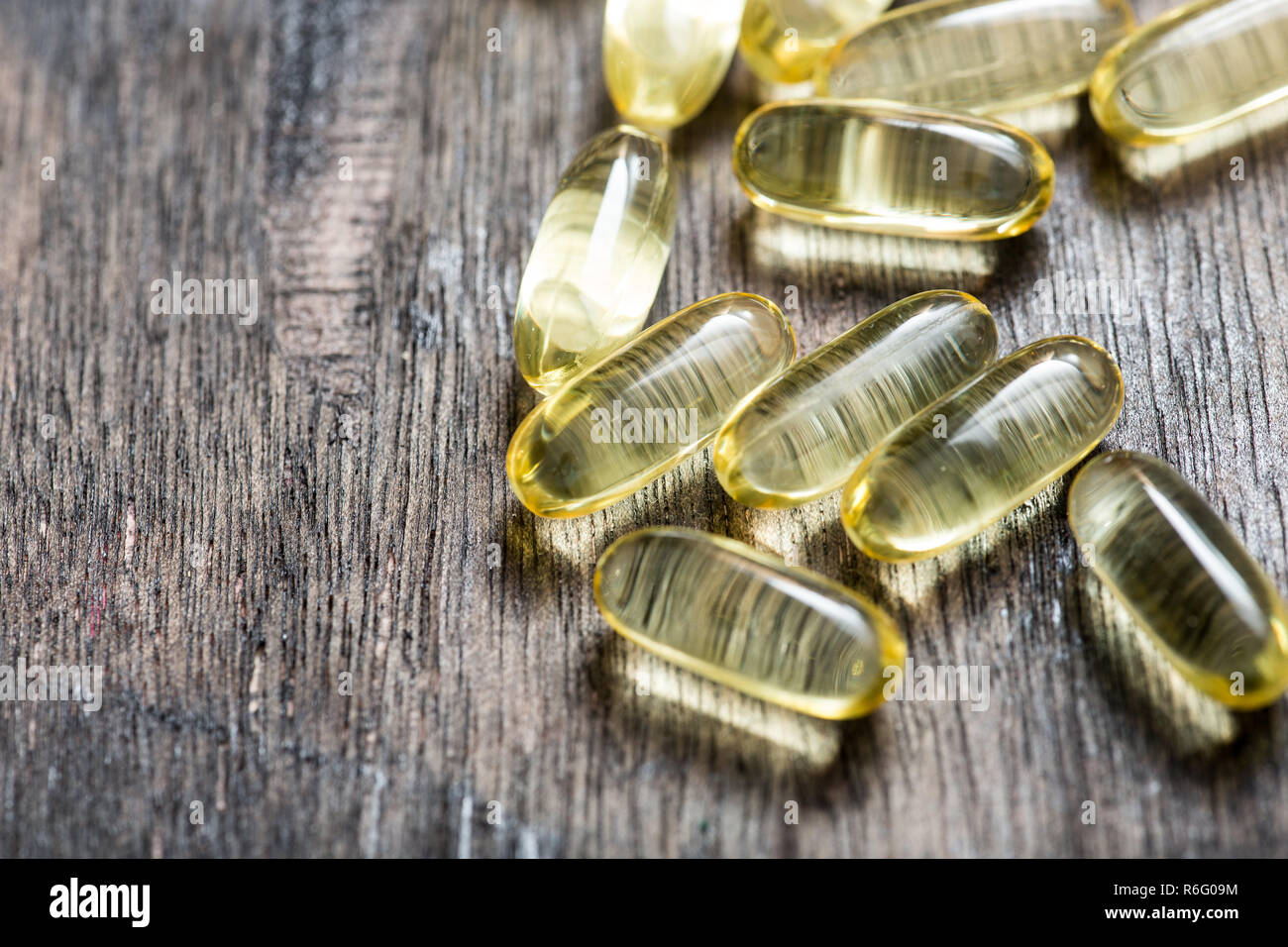 Fish oil capsules with omega 3 and vitamin D. healthy diet concept ...