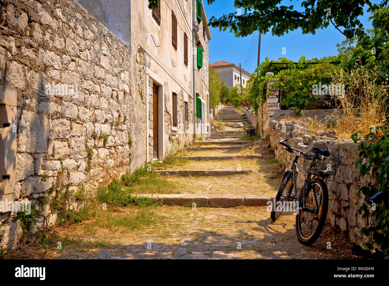 Old stone mediterranean village walkway on Prvic island Stock Photo - Alamy