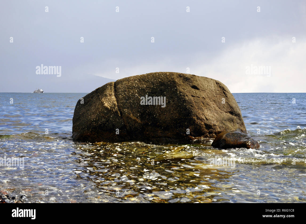 stone in the sea Stock Photo - Alamy