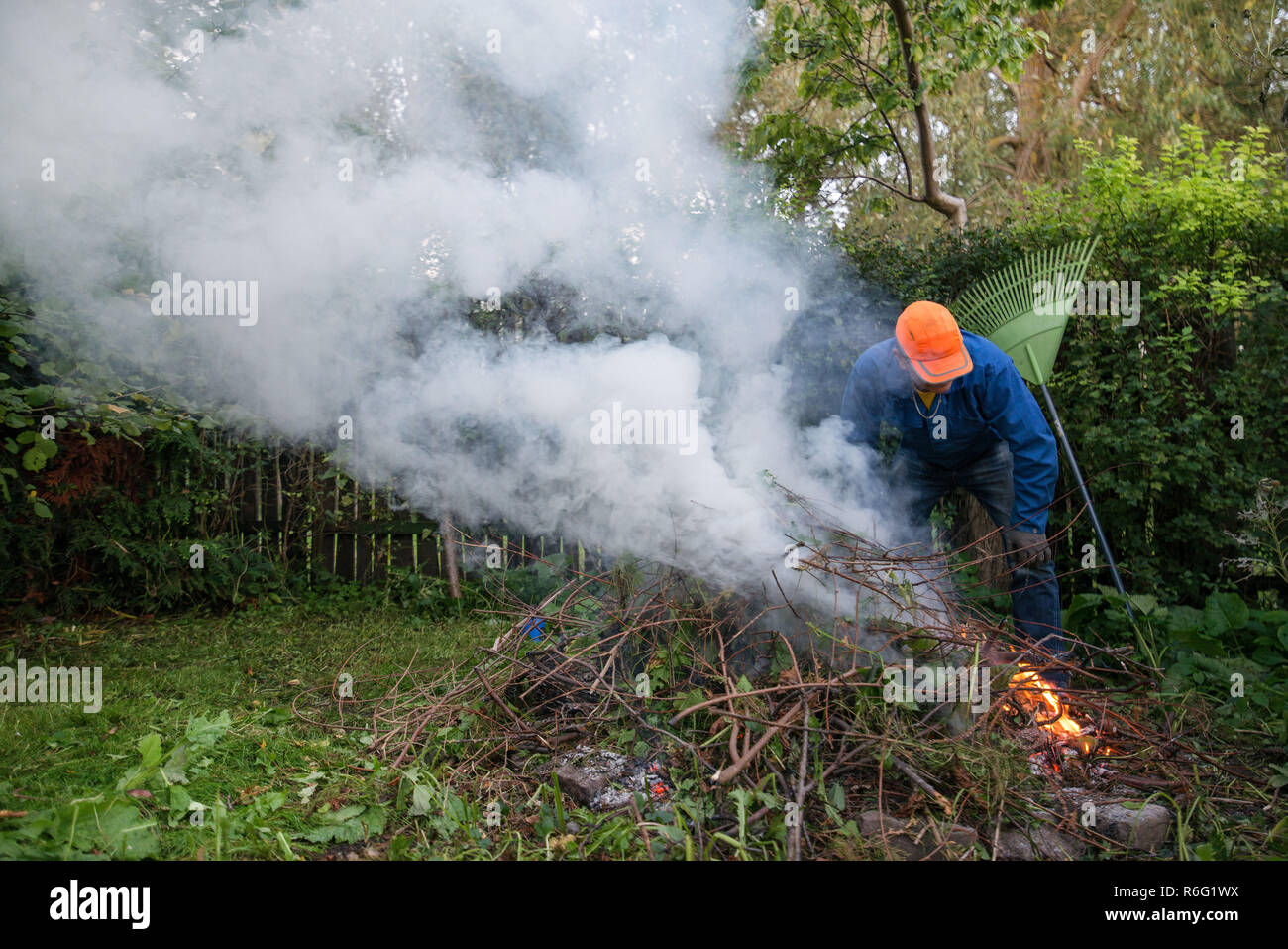 Feeding fire in fireplace hi-res stock photography and images - Alamy