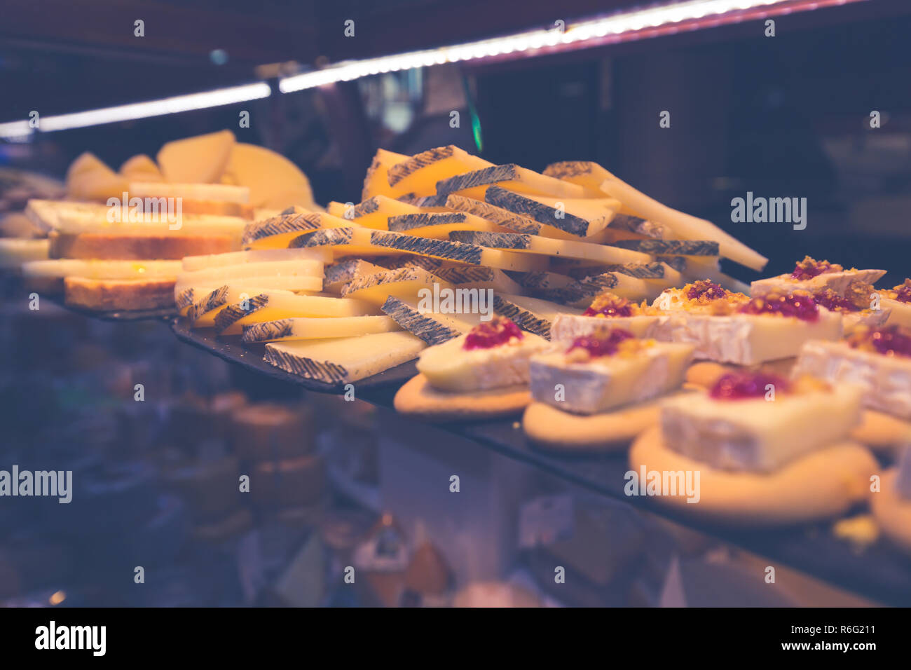 delicious cheese. a lot of pieces of cheese Stock Photo - Alamy
