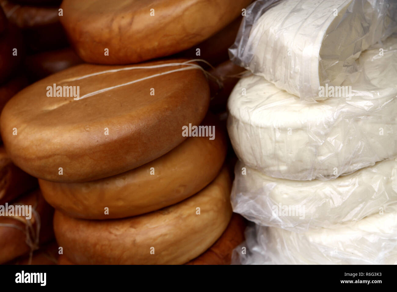 Homemade round cheeses on the farm market Stock Photo - Alamy