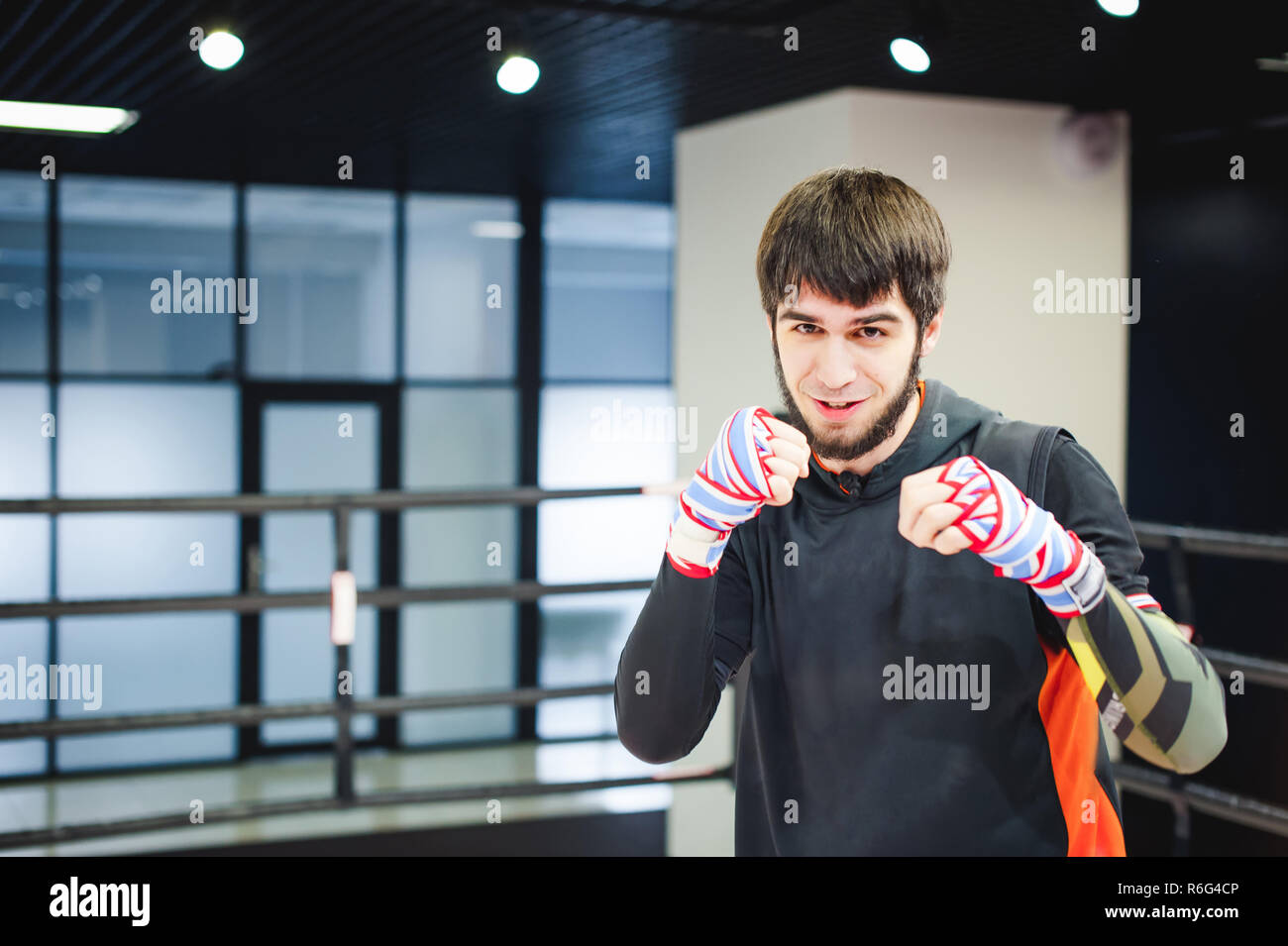 Professional Muay Thai fighter. Male boxer in training sportswear, an ...