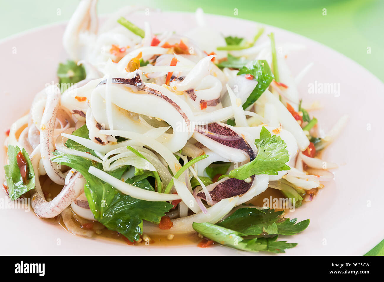 Thai spicy squid salad Stock Photo - Alamy