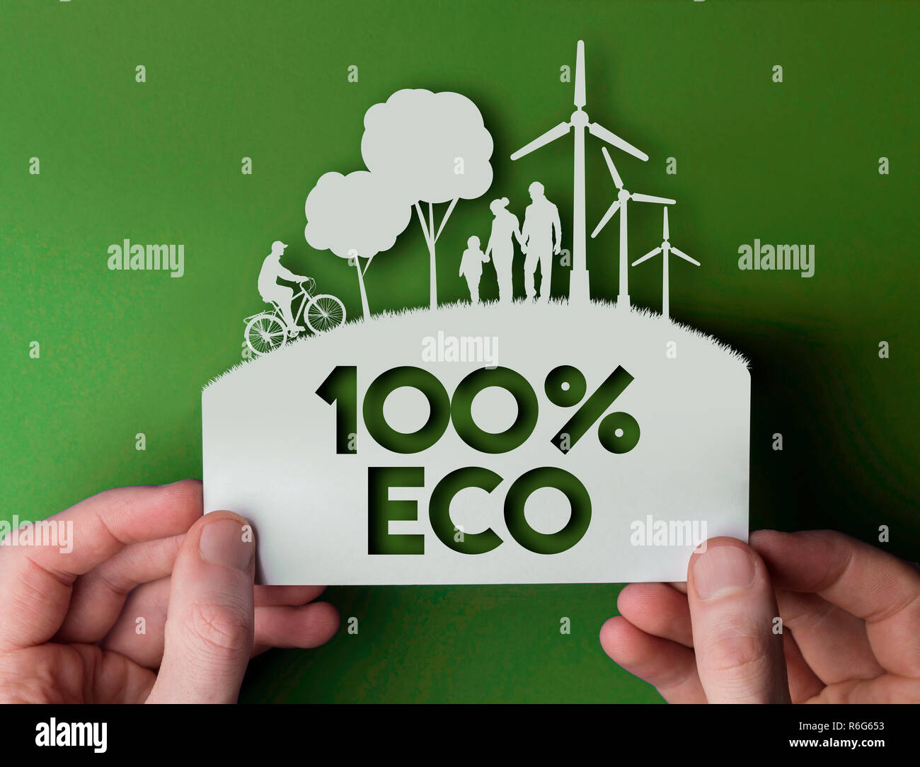 100% Eco - green environmental paper background with wind turbines ...