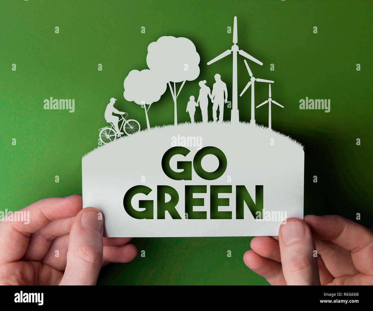 Go Green - green environmental paper background with wind turbines ...
