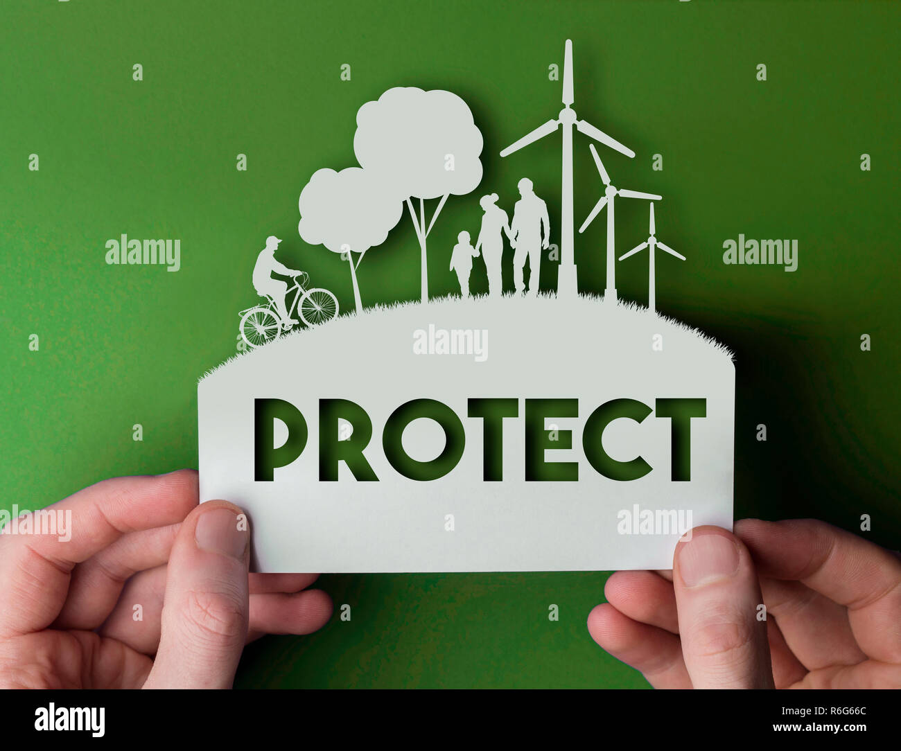 Protect - green environmental paper background with wind turbines ...